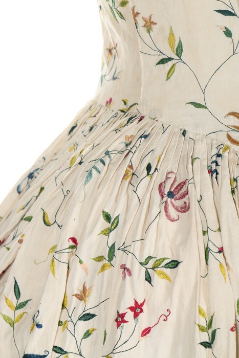 Lot 40 - An embroidered linen open robe, English,