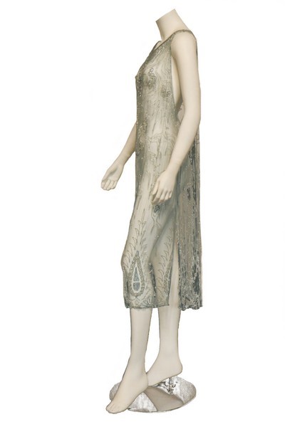 Lot 312 - A sea-blue beaded tulle tabard, 1920s, the