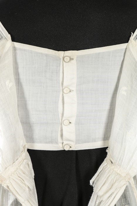 Lot 36 - A sprigged muslin dress, circa 1800, the