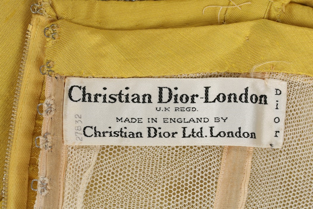 Lot 100 - A fine Christian Dior beaded slubbed yellow