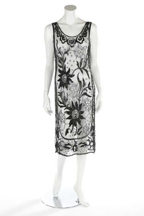 Lot 145 - A black tulle tabard, early 1920s, with
