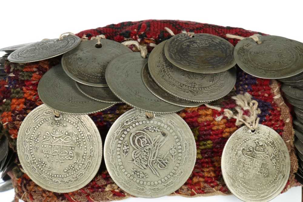 Lot 371 - A coin adorned headdress or 'money hat',