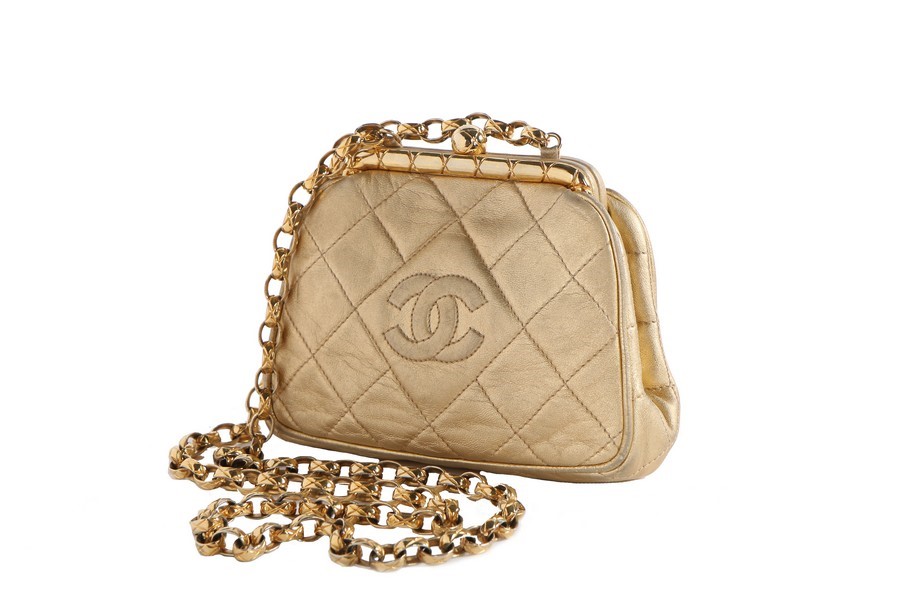 Lot 108 - A Chanel quilted gold leather mini bag,