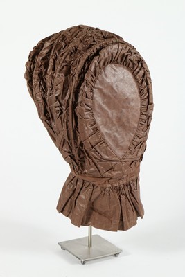 Lot 57 - A brown glazed cotton calche bonnet, circa