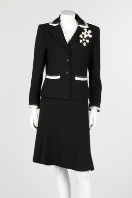 Lot 12 - A Chanel black wool suit with white satin