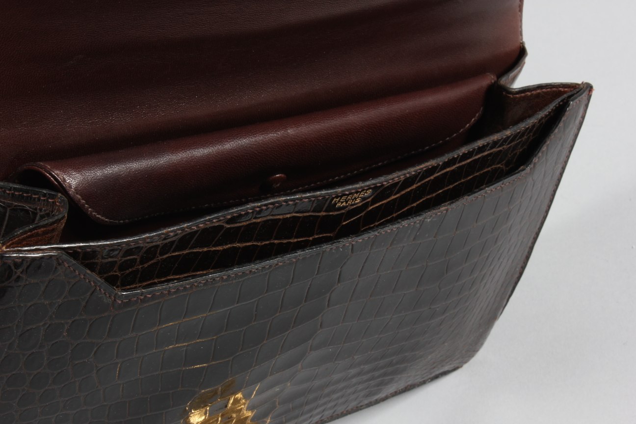 Lot 73 - An Hermès brown crocodile handbag, circa 1970,