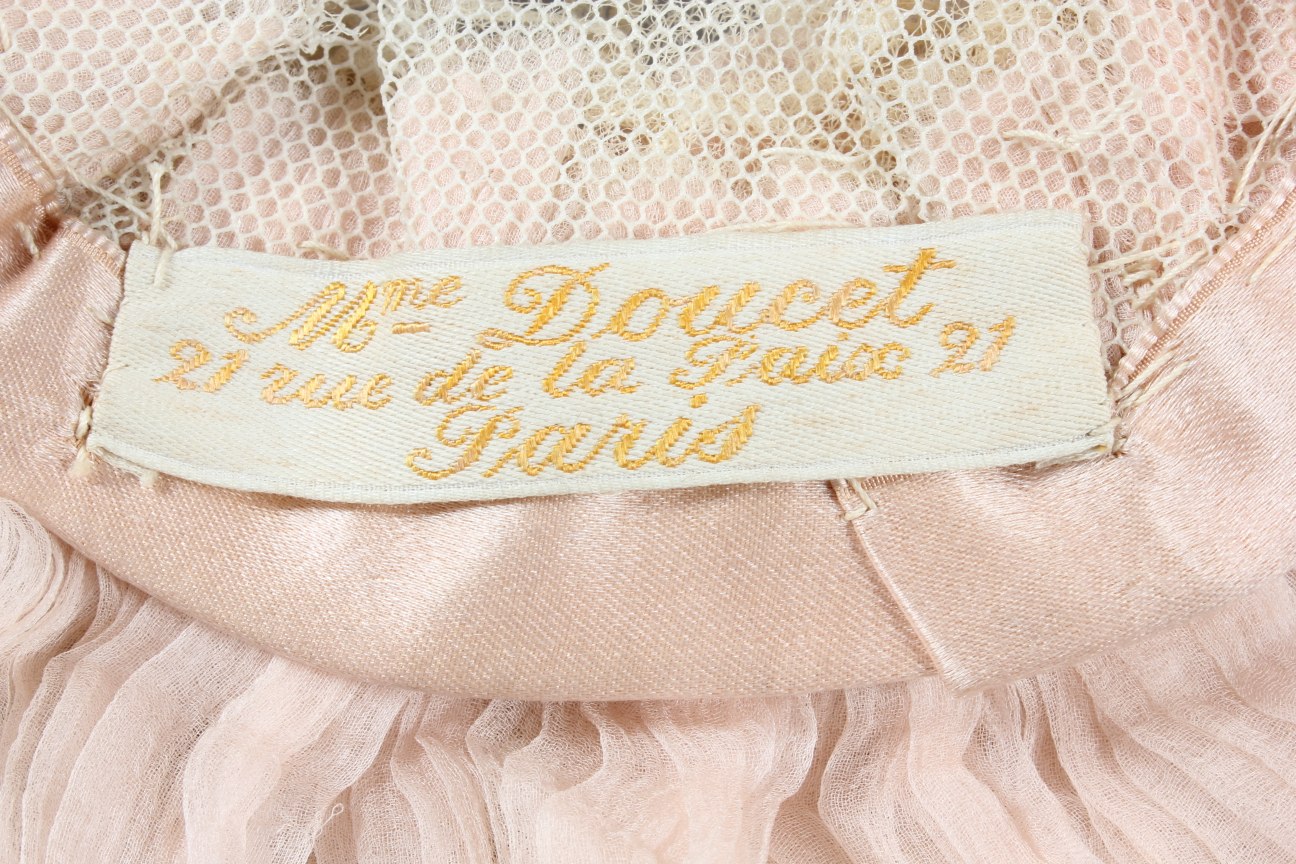 Lot 219 - A Madame Doucet Brussels lace and pink