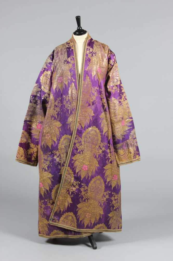Lot 326 - A brocaded gold and purple satin chapan robe,