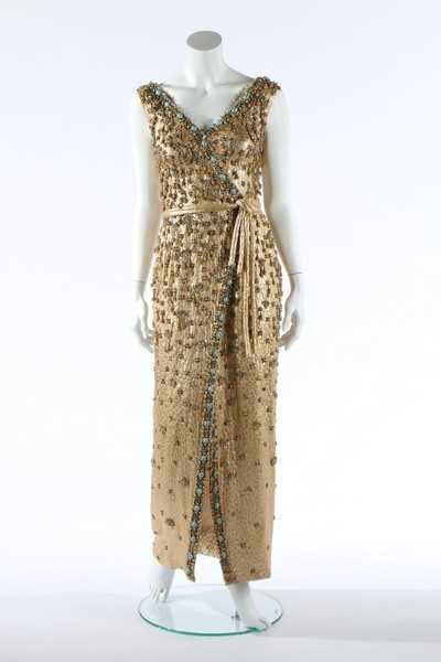 Lot 159 - A Pierre Balmain beaded gold cloqué evening